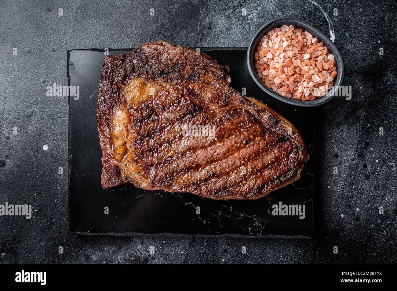 Grilled wagyu Rib Eye steak, marbled beef meat with salt. Black ...