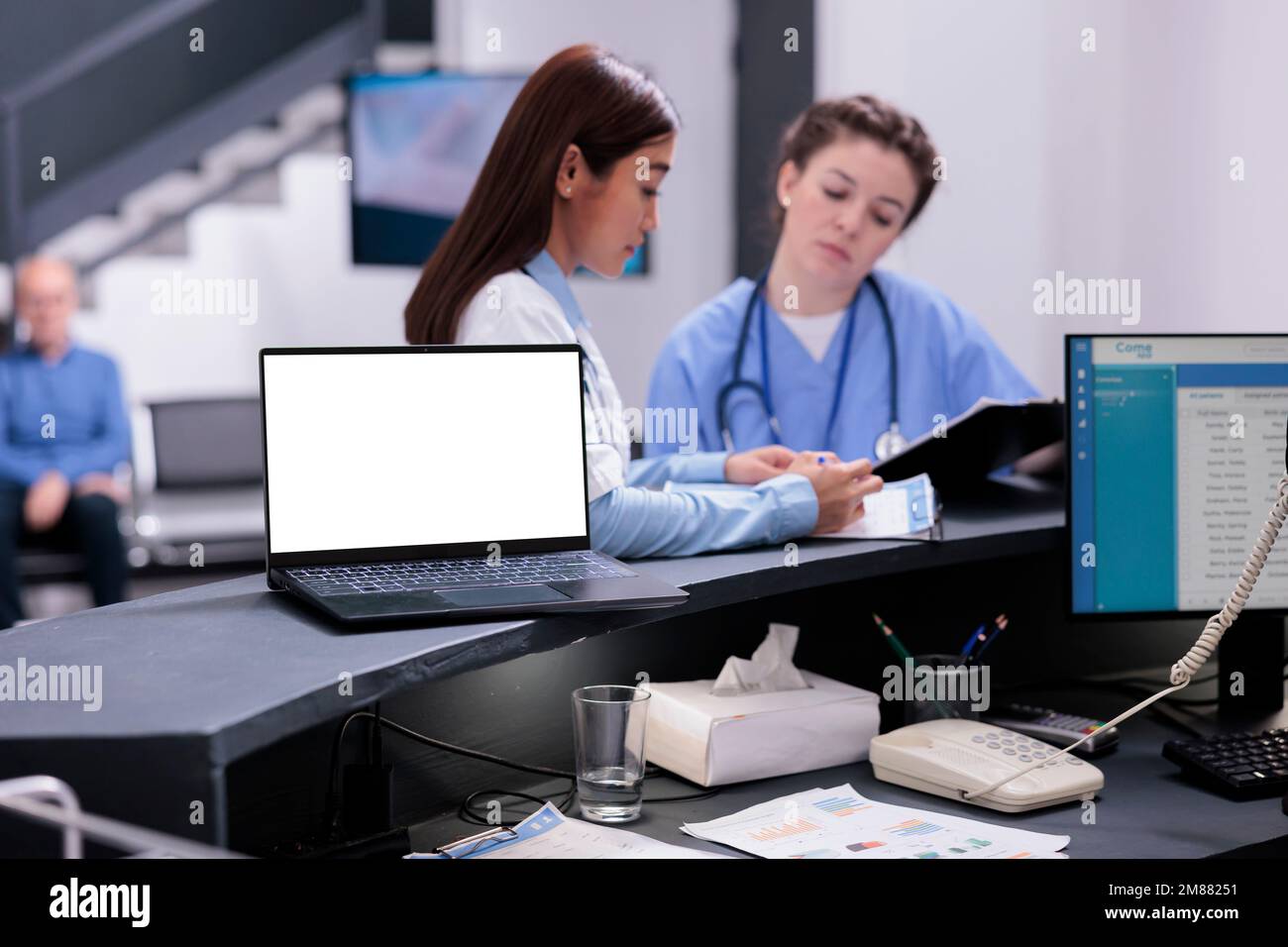 Laptop computer with isolated white screen standing on registration ...