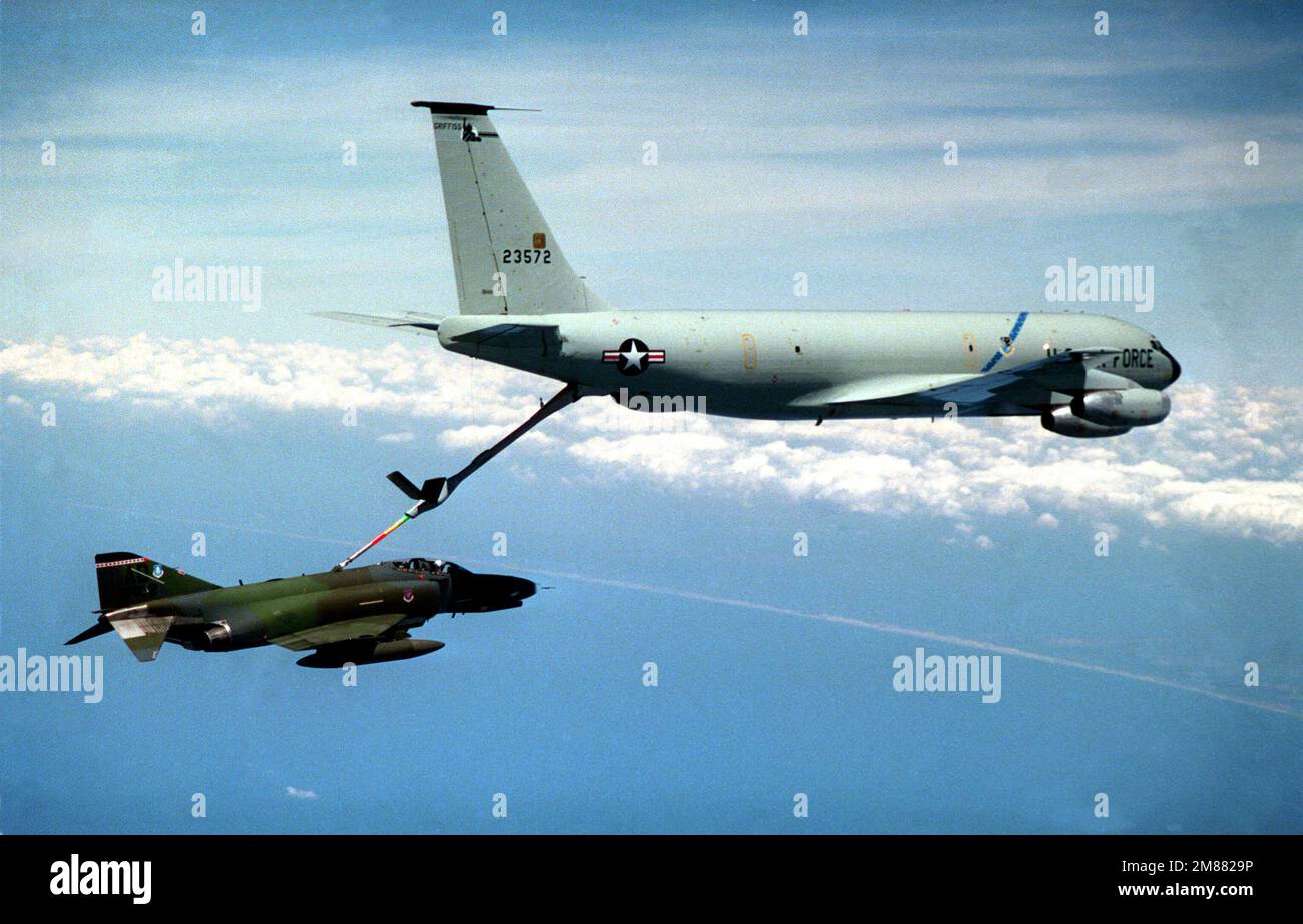 Shot of KC-135 Stratotanker aircraft refueling an F-4 Phantom aircraft ...
