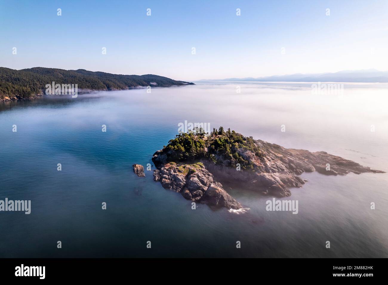 Aerial view above clouds, fog bank, coastline of Vancouver Island ...