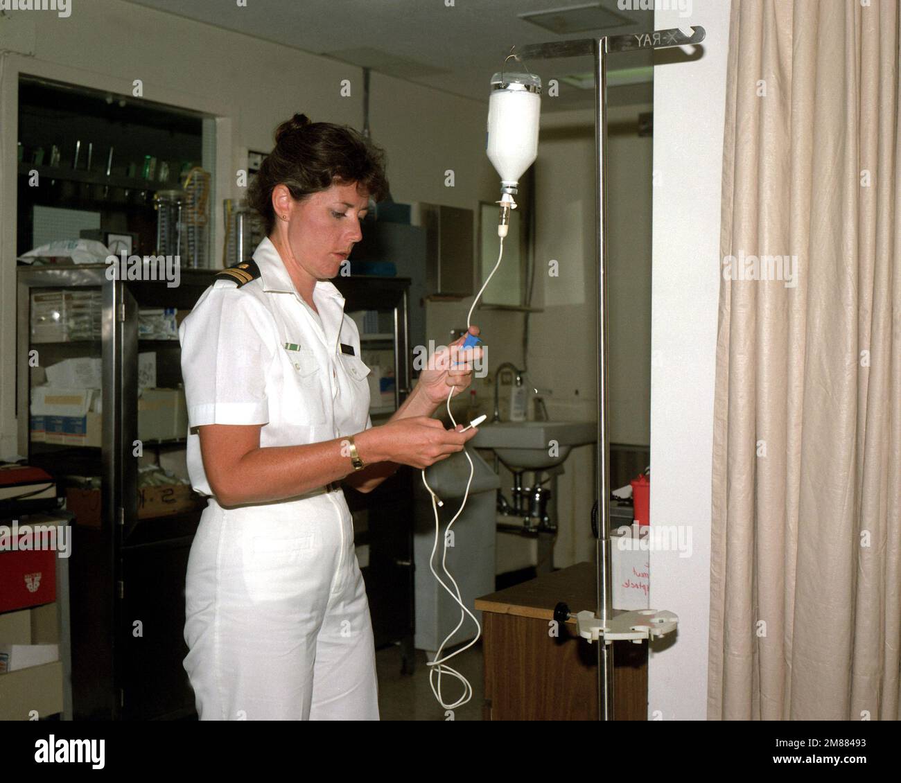 LT. Robin McKenzie, a nurse at the station's hospital, retrieves some ...