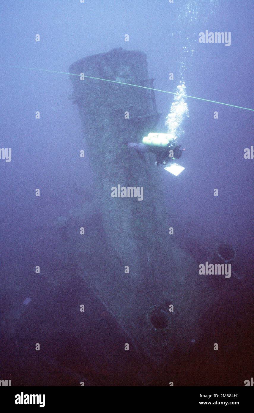 A Navy diver from Moible Diving Salvage Unit One tracks a survey line ...