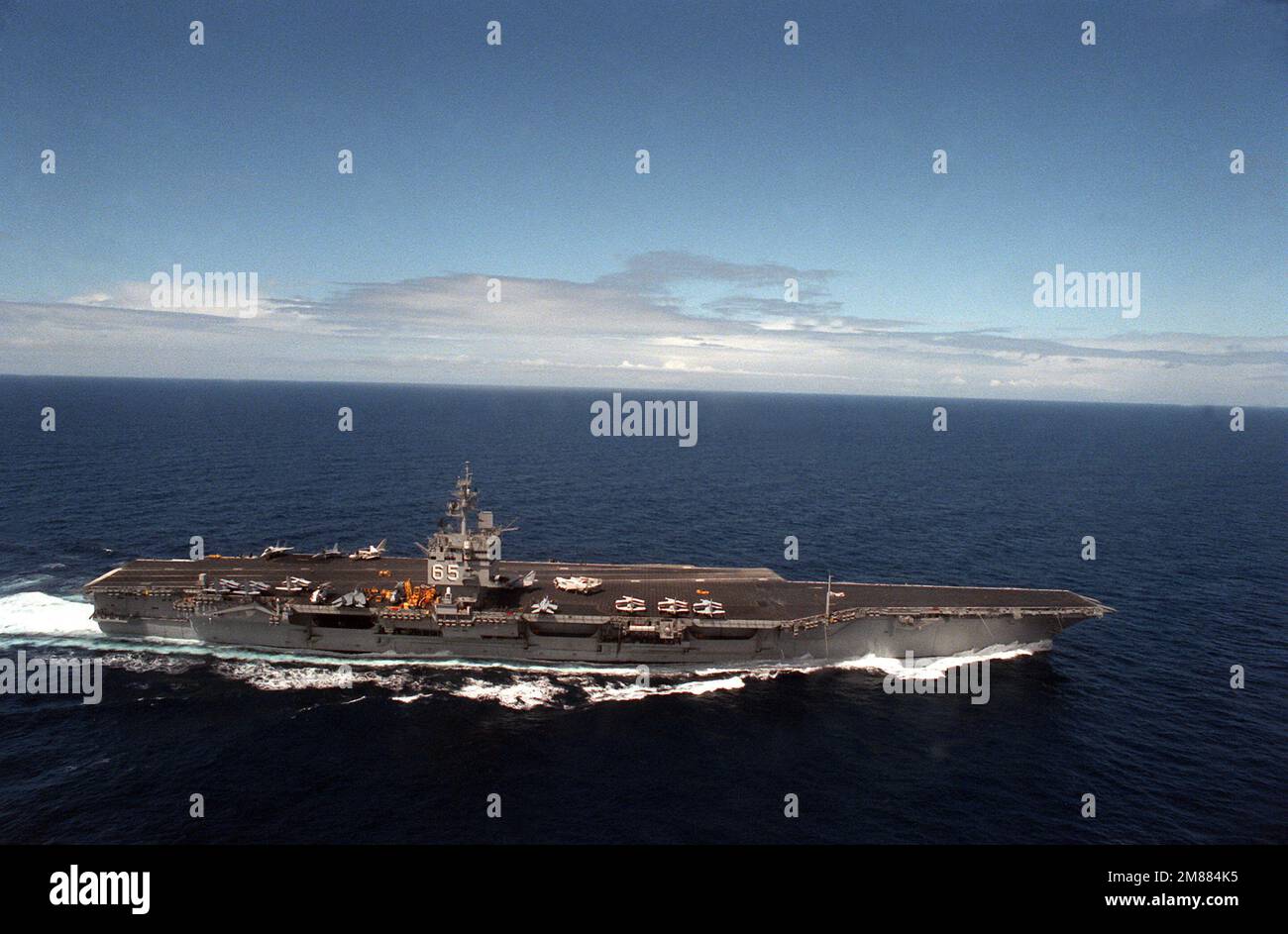 A starboard beam view of the nuclear-powered aircraft carrier USS ...