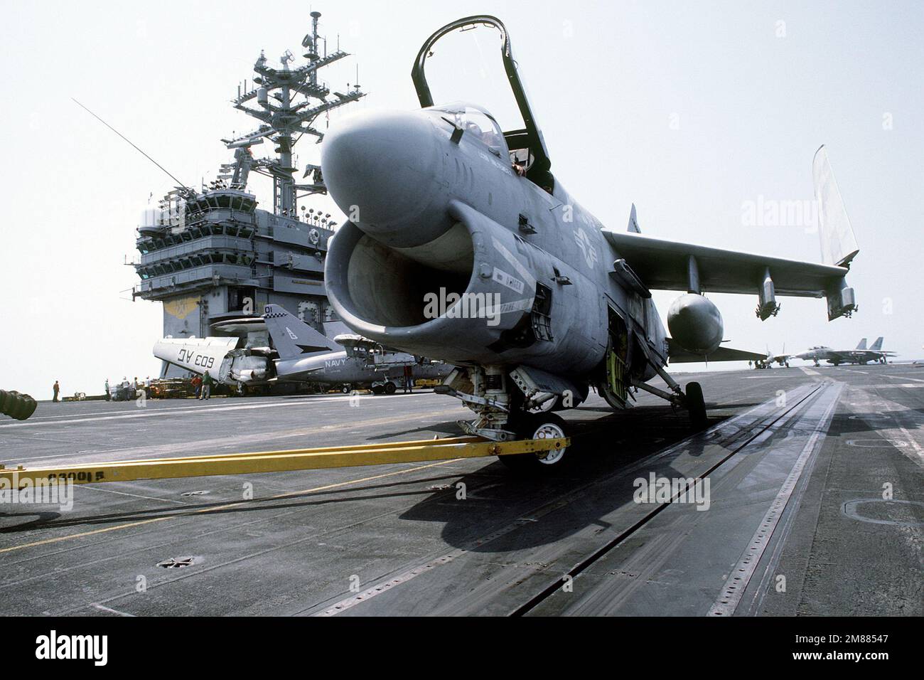 An Attack Squadron 72 (VA-72) A-7E Corsair II aircraft is towed to the ...
