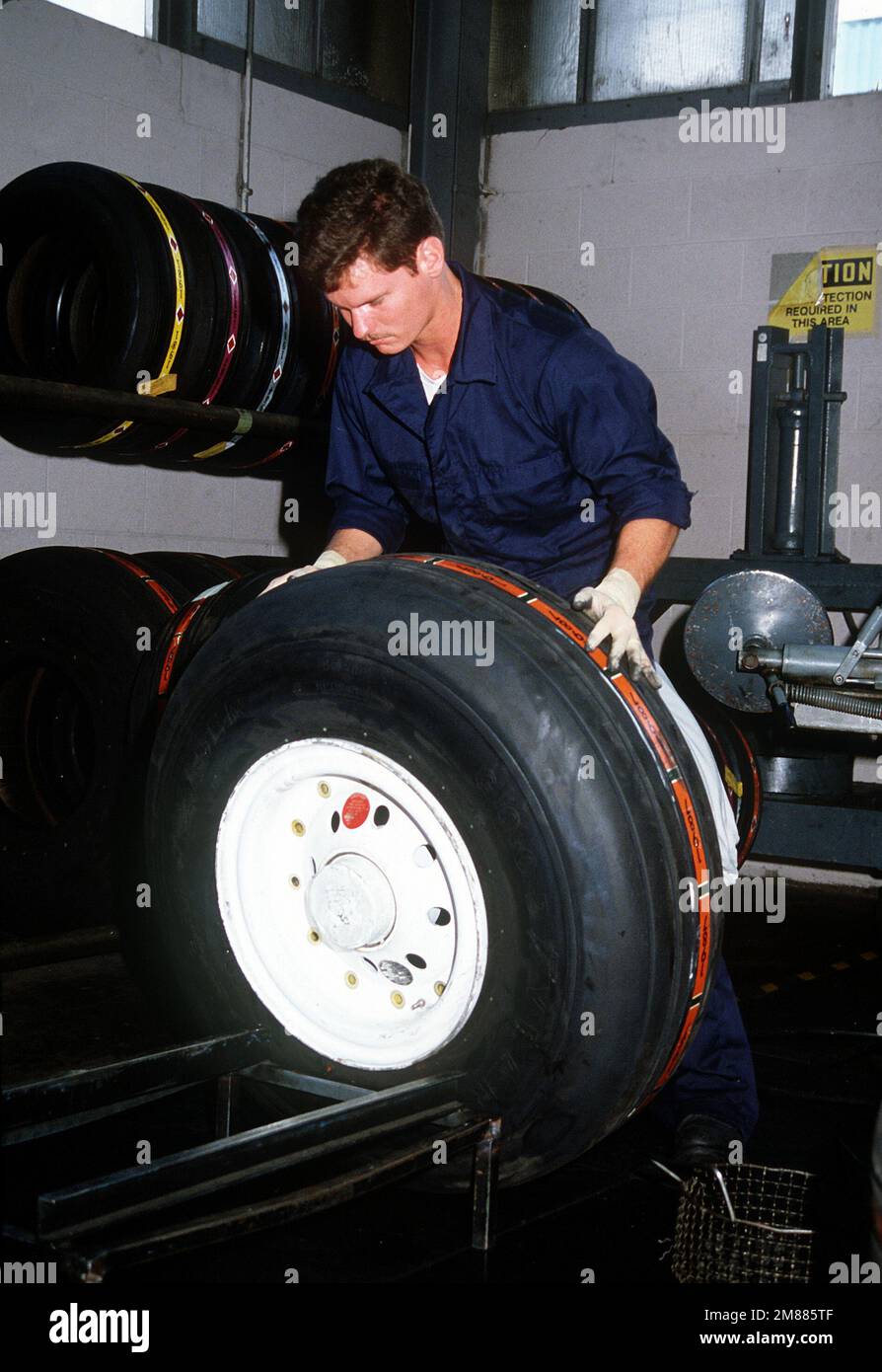 Aviation Structural Mechanic S (Structures) AIRMAN M. Thompson moves a ...
