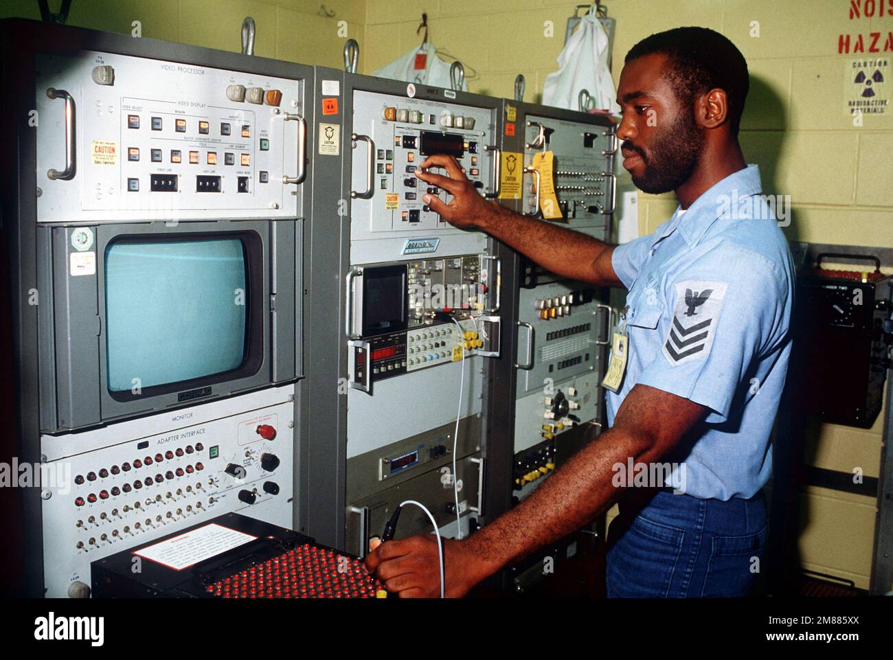 Aviation Electronics Technician 1ST Class Anthony J. Hawkins uses the ...