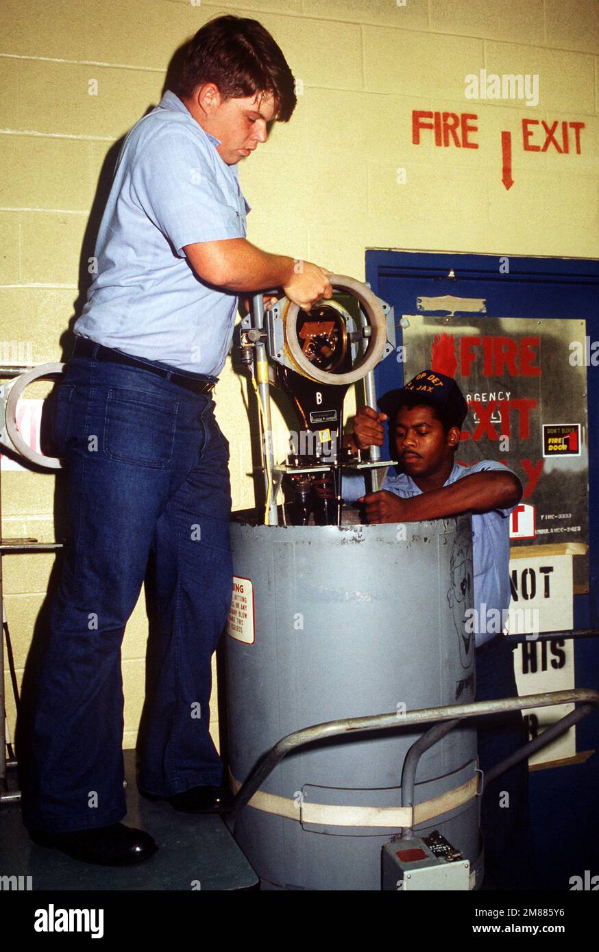 Two aviation anti-submarine warfare technicians working in an Aircraft ...