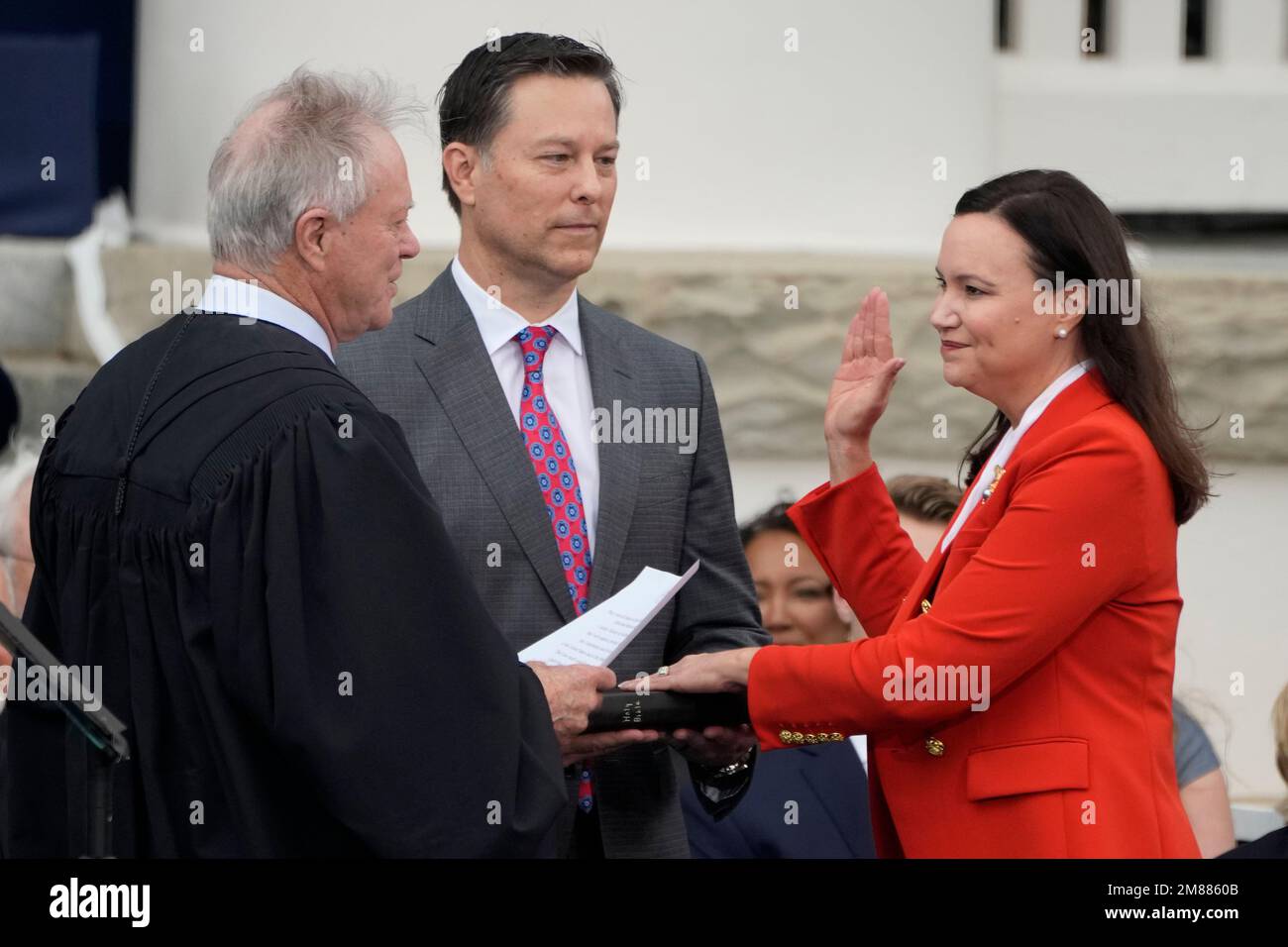 Florida Attorney General Ashley Moody, right, is sworn in by her father ...