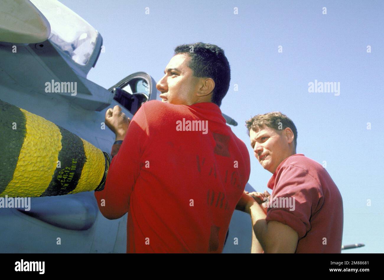Ordnancemen of Attack Squadron 165 (VA-165) mount a Mark 82 500-pound ...