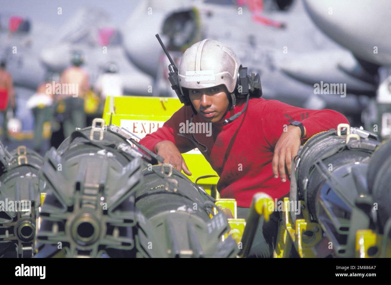 An ordnanceman of Attack Squadron 165 (VA-165) inspects Mark 82 500 ...