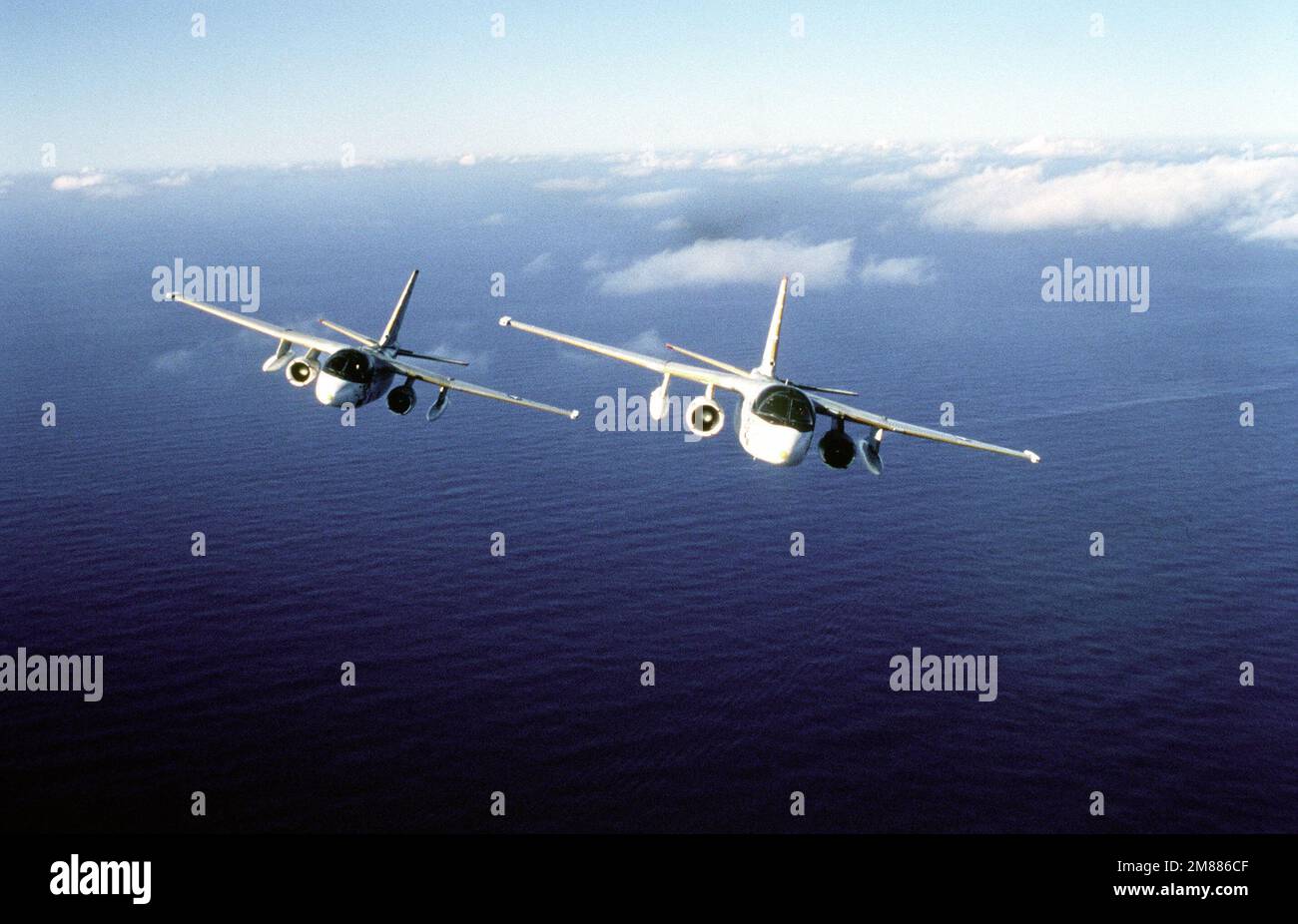 An air-to-air front view of two S-3A Viking aircraft flying in ...