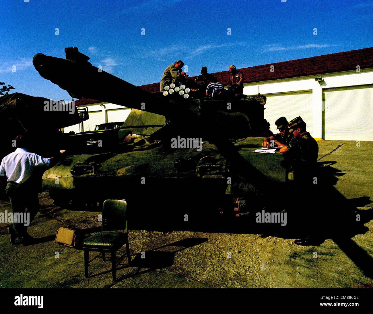 Soldiers install the Hoffman detonator training device on the 105mm gun ...