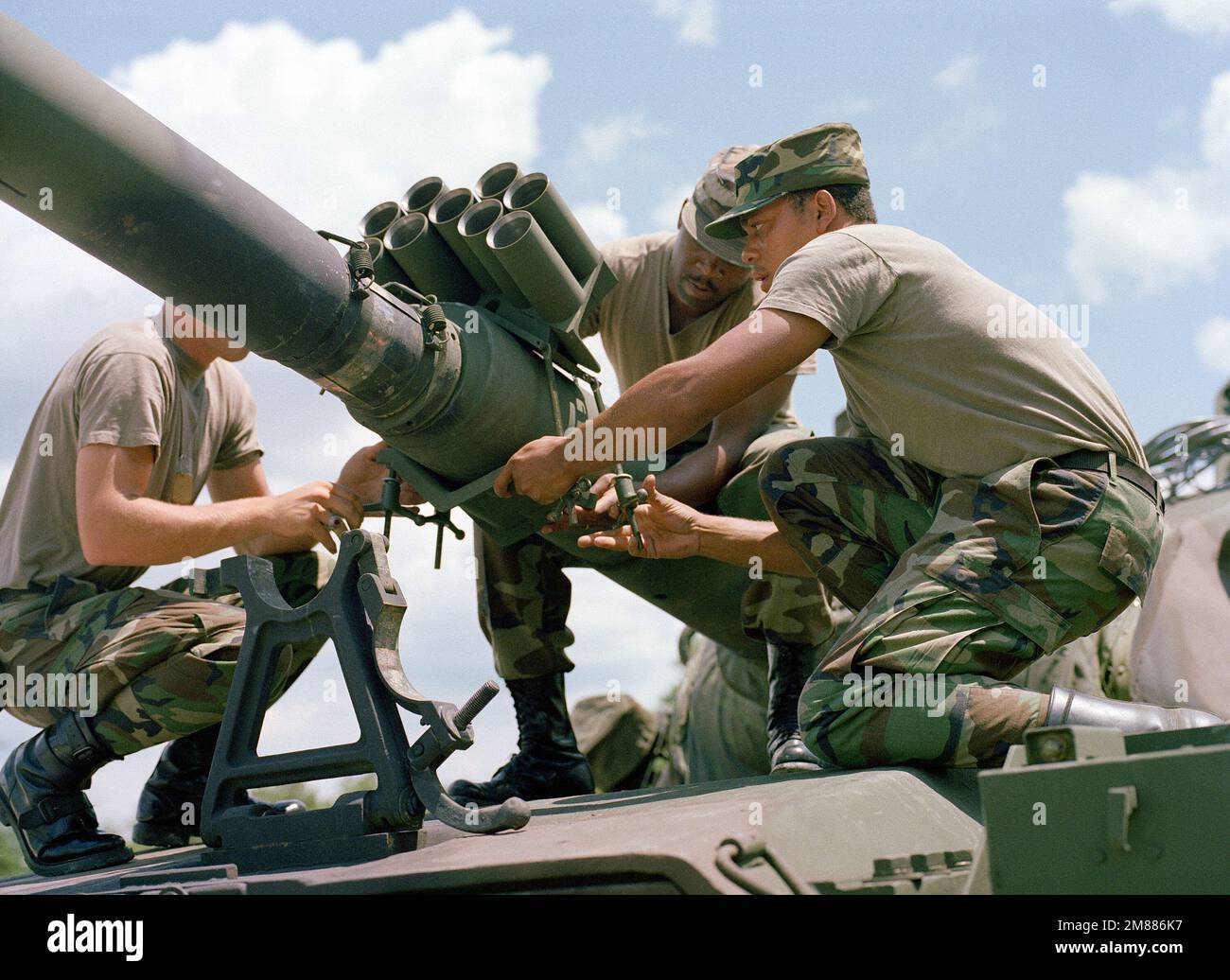 Soldiers secure a Hoffman detonator training device on the 105mm gun of ...