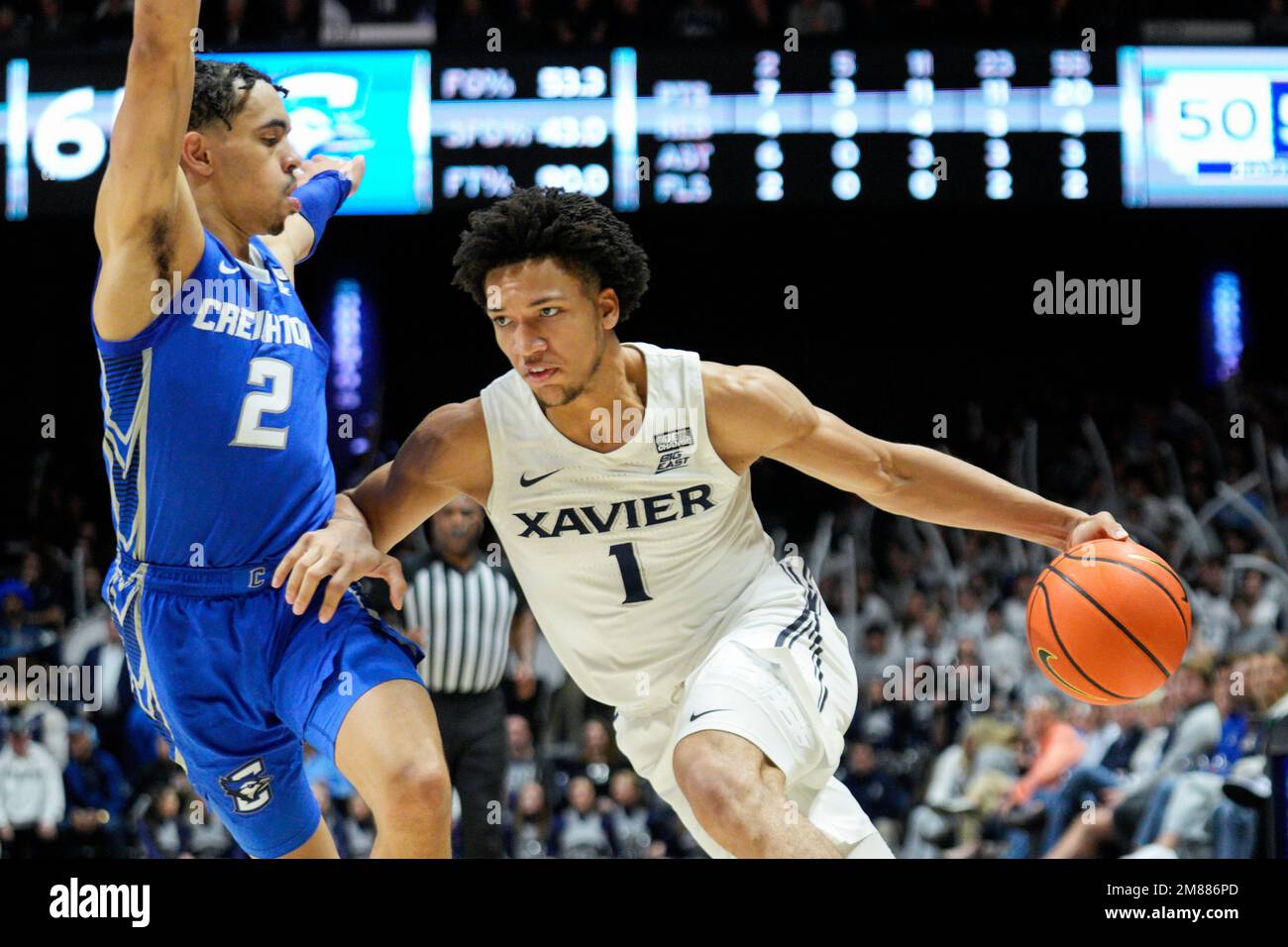 Xavier guard Desmond Claude (1) drives against Creighton's Ryan Nembhard (2) during the second ...