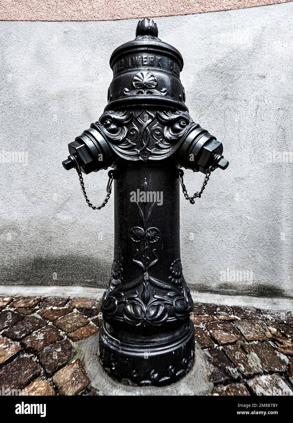 Old fire hydrant, water column on the street in Sion, Swiss Stock Photo ...