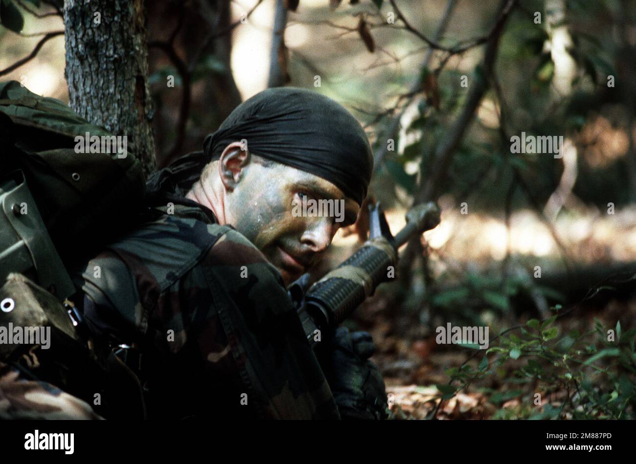 A student at the Scout Sniper Instructor School assumes a defensive ...