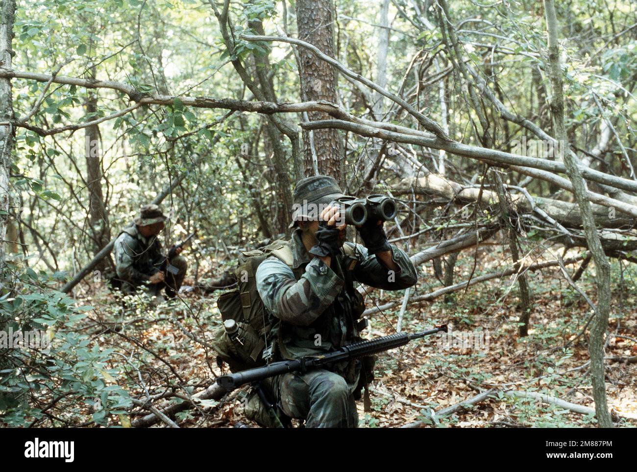 Students at the Scout Sniper Instructor School armed with M-16A2 rifles ...