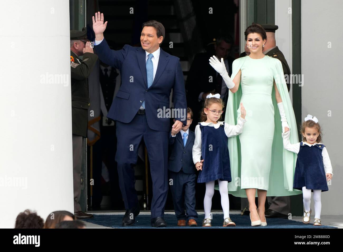Florida Gov. Ron DeSantis waves as he stands with his wife Casey and ...