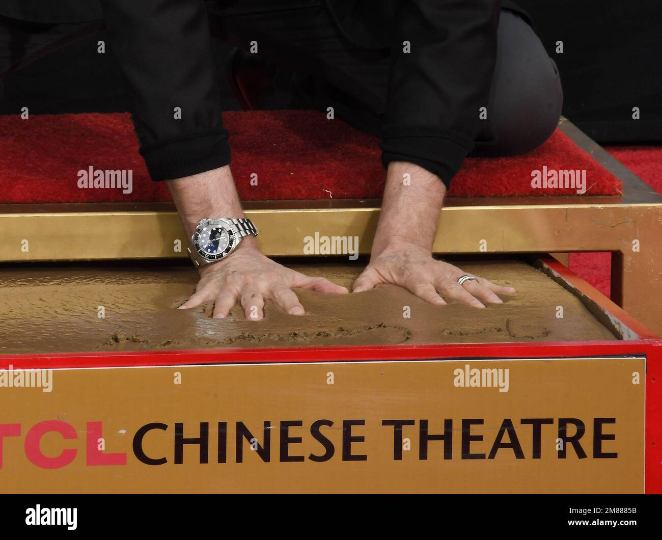 Hands in cement hi-res stock photography and images - Alamy