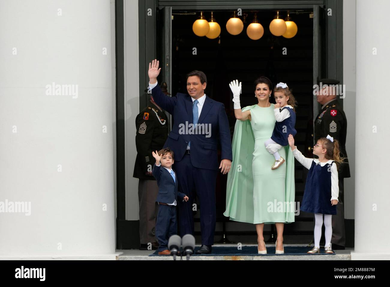 Florida Gov. Ron DeSantis waves as he stands with his wife Casey and ...
