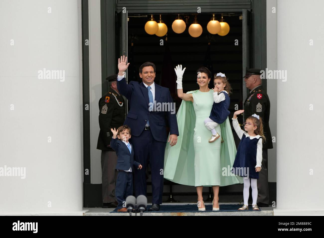 Florida Gov. Ron DeSantis waves as he stands with his wife Casey and ...