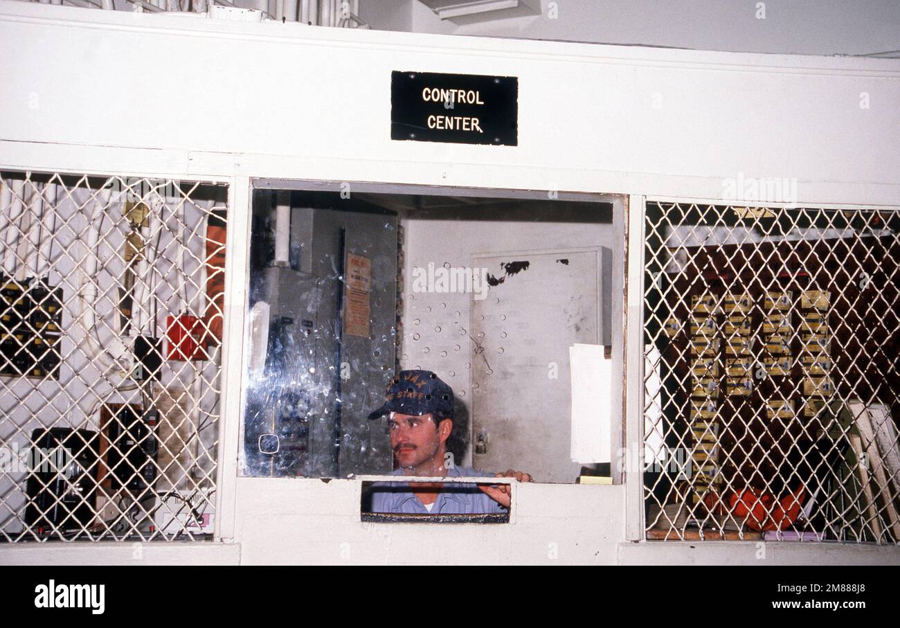 A boatswain's mate stands his watch at the brig control center. Base ...