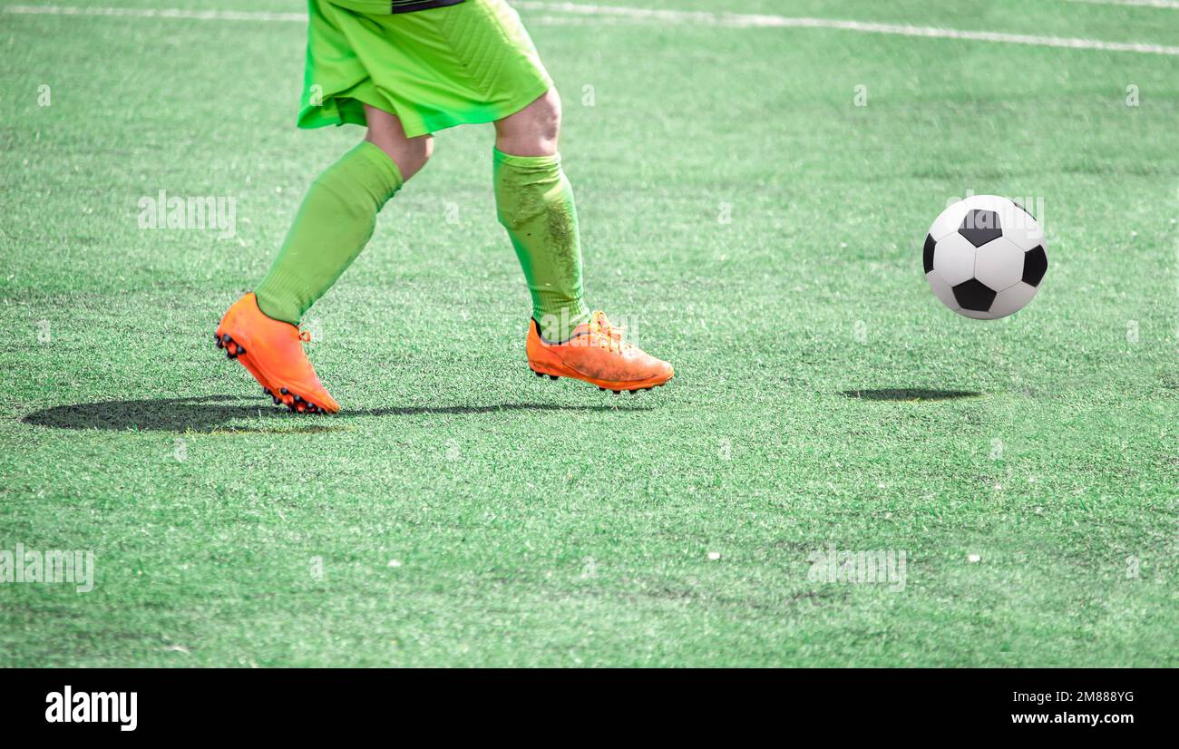 Shot of young boy playing soccer on a sports field Stock Photo - Alamy