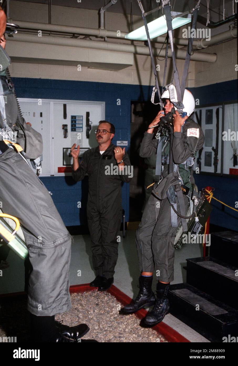 A hospital corpsman instructs students in hookup and jump procedures ...