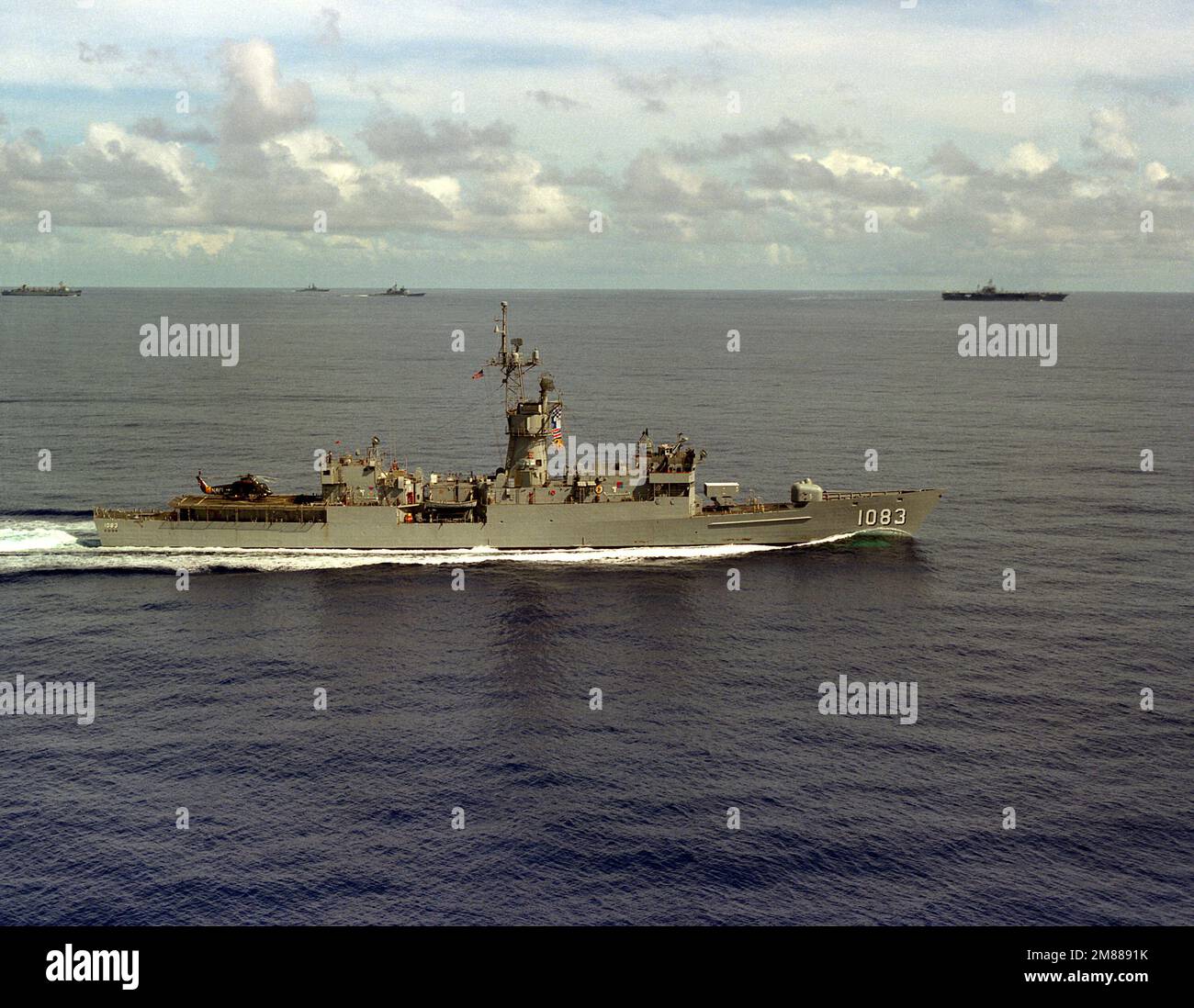 A starboard beam view of the frigate USS COOK (FF-1083) underway with ...
