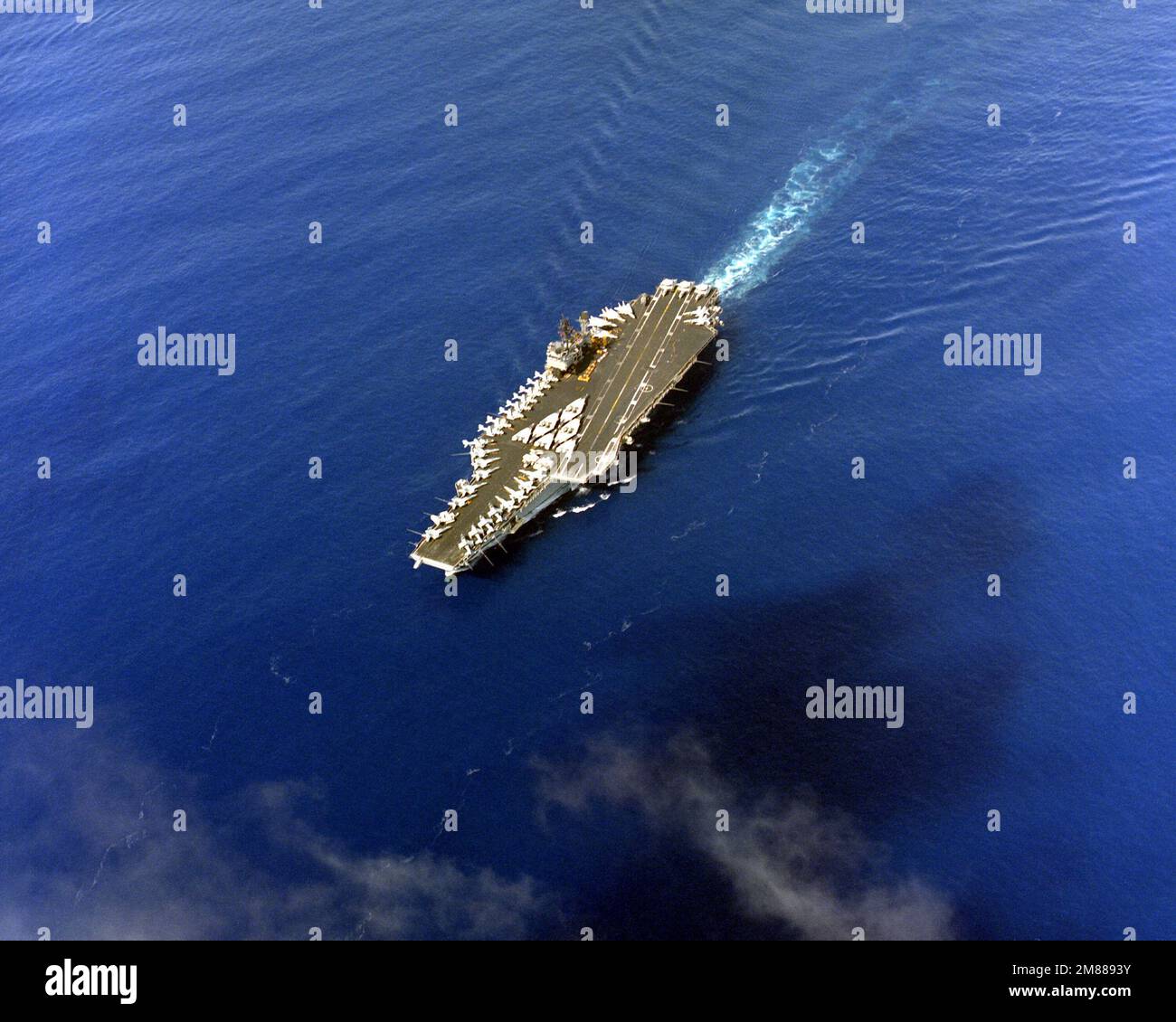 An aerial port bow view of the aircraft carrier USS CONSTELLATION (CV ...