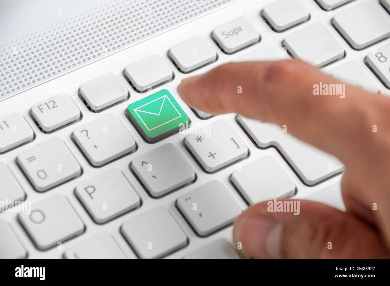 Online Communication concept: Male hand pressing computer key with e ...