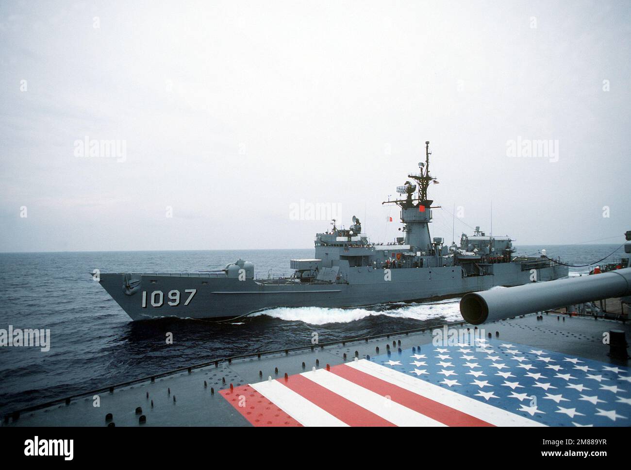 A port bow view of the frigate USS MOINESTER (FF-1097) participating in ...