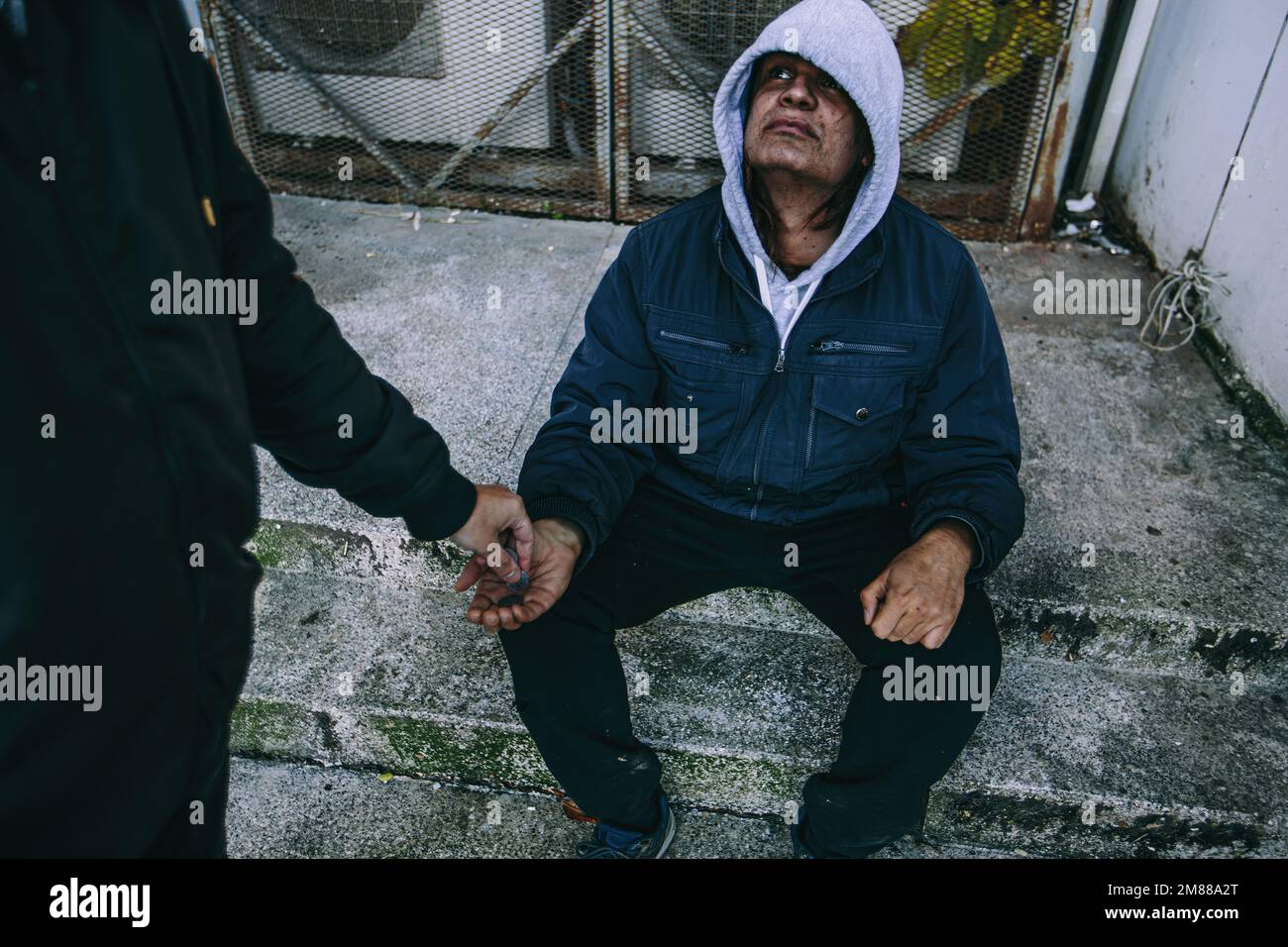 Sad homeless man begs for money at the street Stock Photo - Alamy