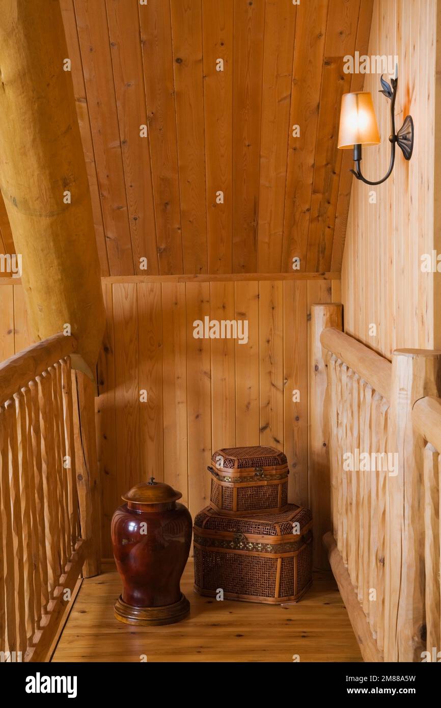 Small mezzanine with rustic railings and decorated with fancy wicker ...