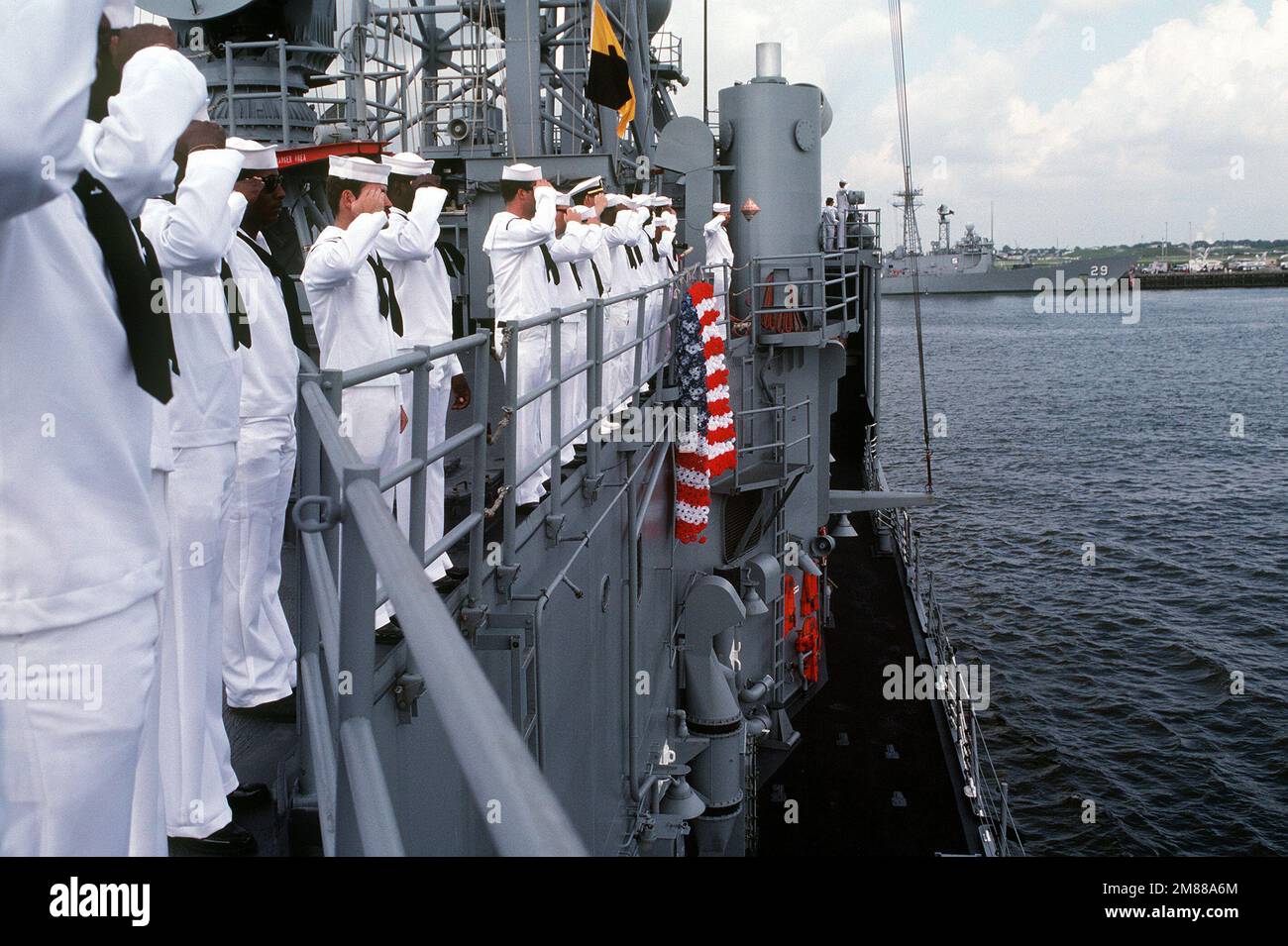 Crew members man the rails of the guided missile frigate USS STARK (FFG ...