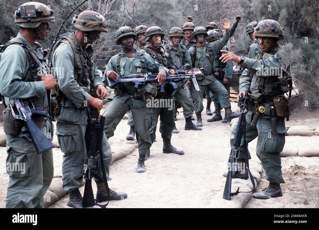 A troop leader of the 5th Battalion, 87th Infantry Brigade, goes over ...
