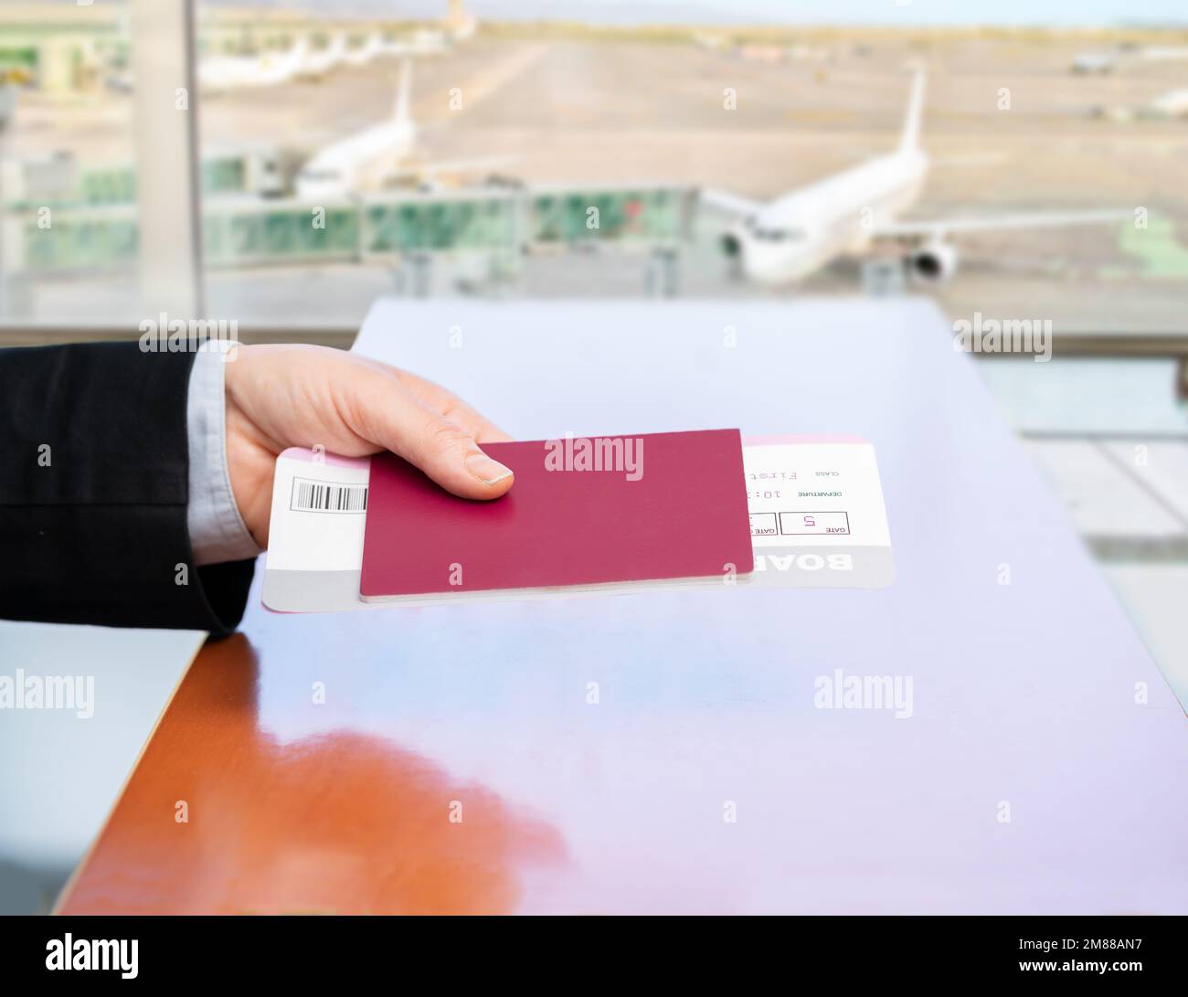 Cropped shot of an unrecognizable stewardess handing over her ID book ...
