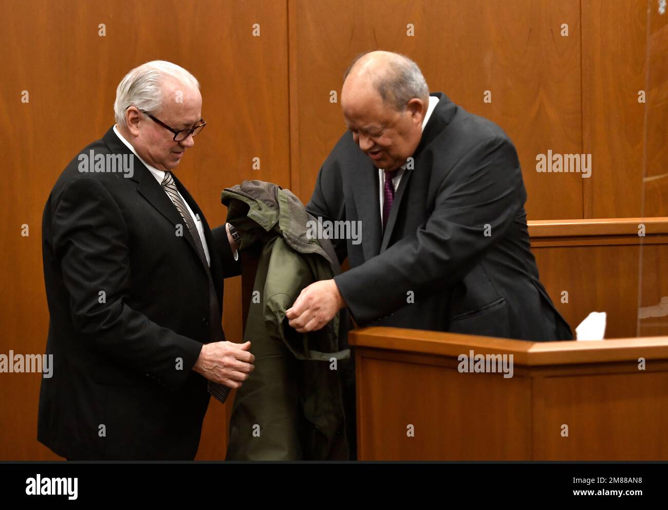 Special Prosecutor Robert Jambois, left, helps Dr. Michael Chambliss ...