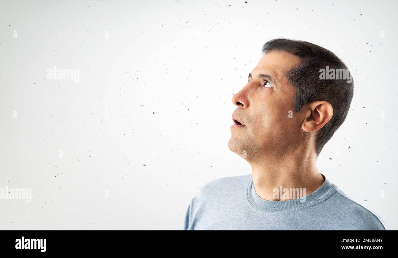 Portrait of a surprised young man looking up with copy space Stock ...