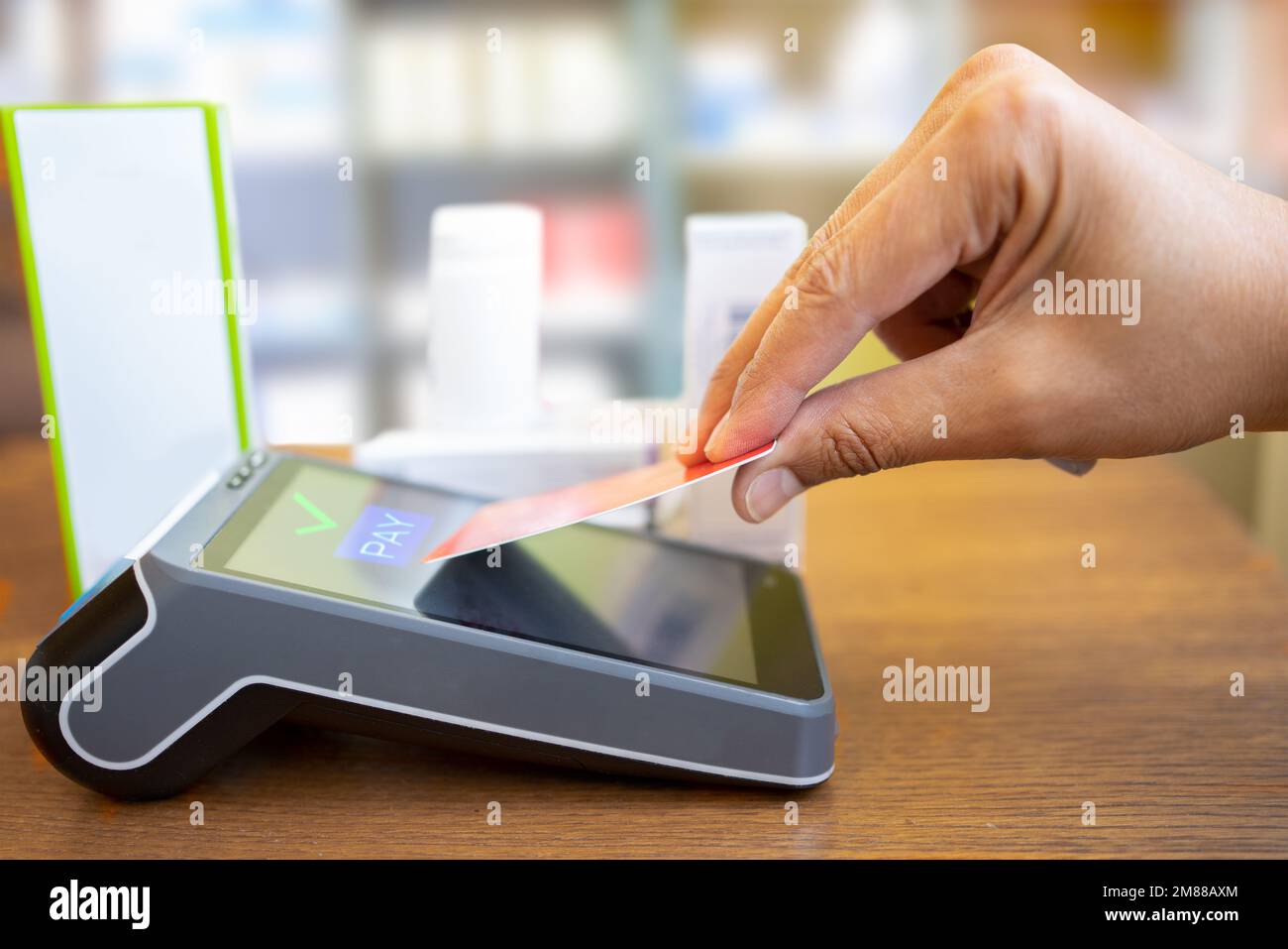 Mobile payments concept. Customer is paying using wireless or contact ...
