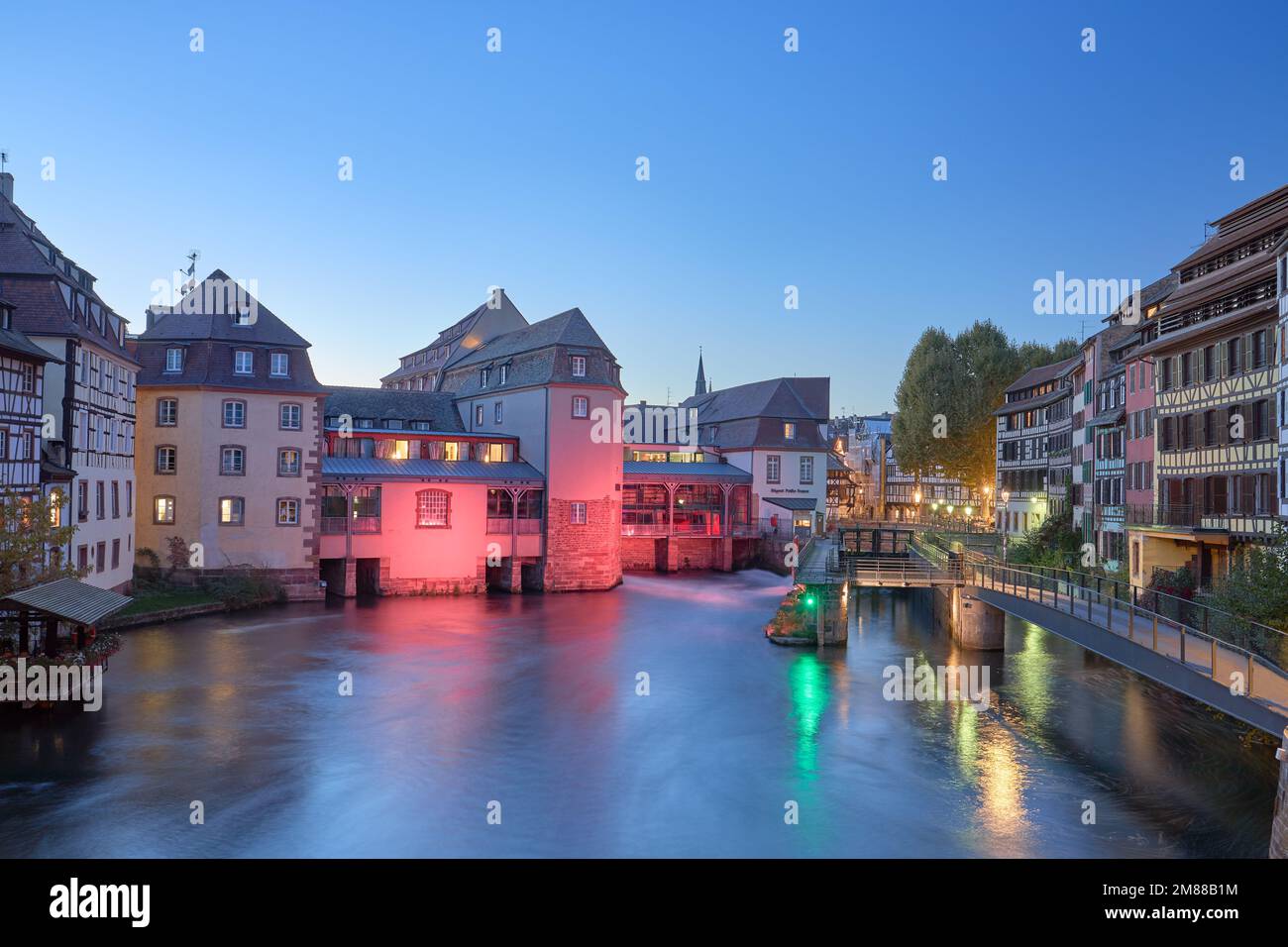 A beautiful view of traditional buildings near the tranquil Ill river ...
