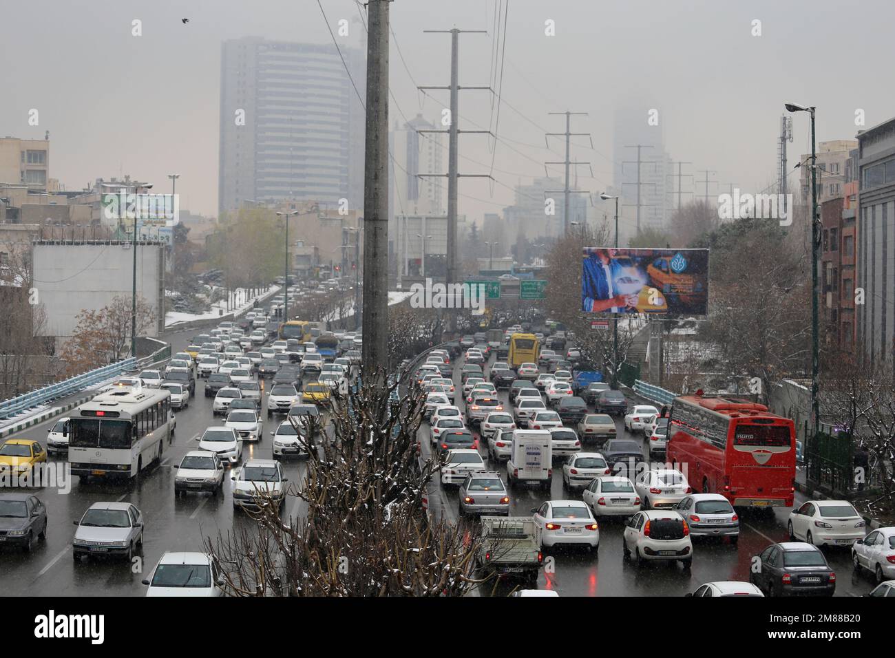 Tehran, Tehran, Iran. 11th Jan, 2023. Vehicles drive slowly along an ...