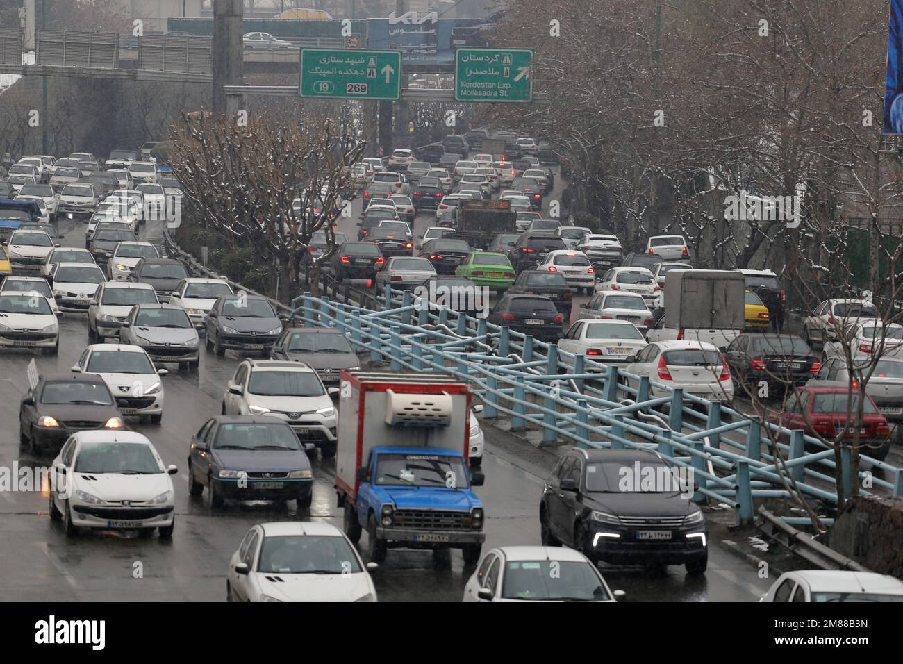 Tehran, Tehran, Iran. 11th Jan, 2023. Vehicles drive slowly along an ...