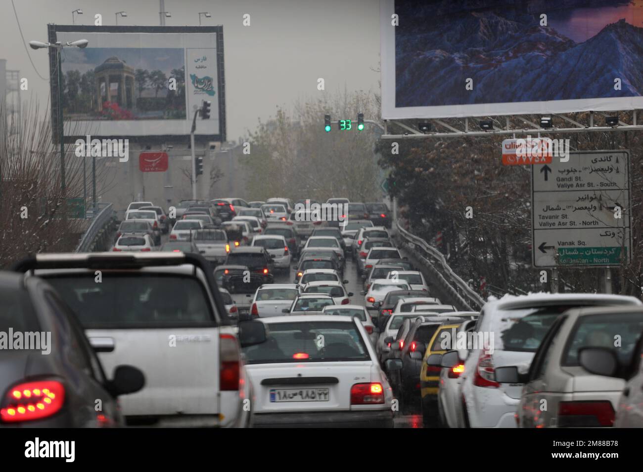 Tehran, Tehran, Iran. 11th Jan, 2023. Vehicles drive slowly along an ...