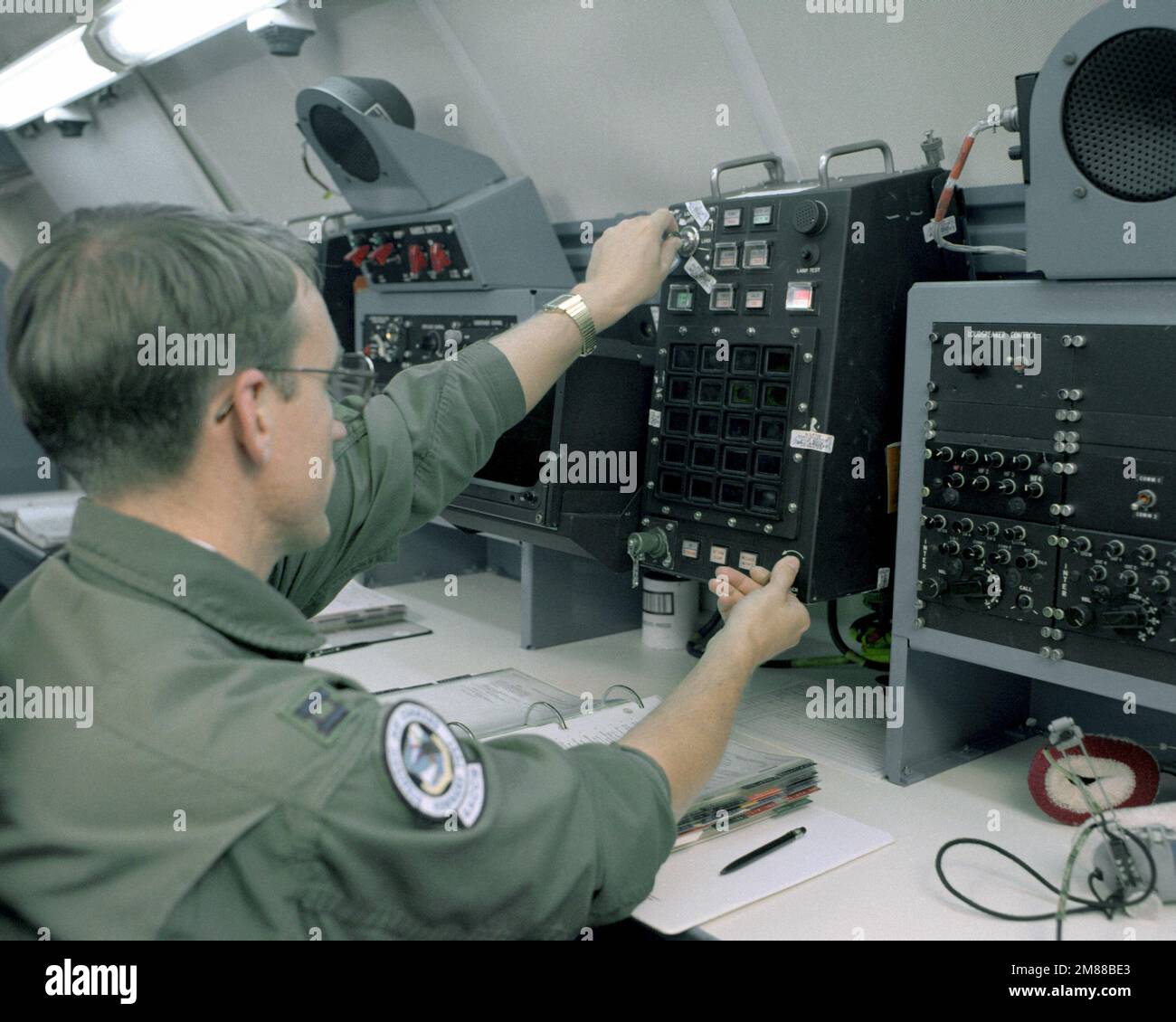Air crew members monitor equipment in the air launch control center ...