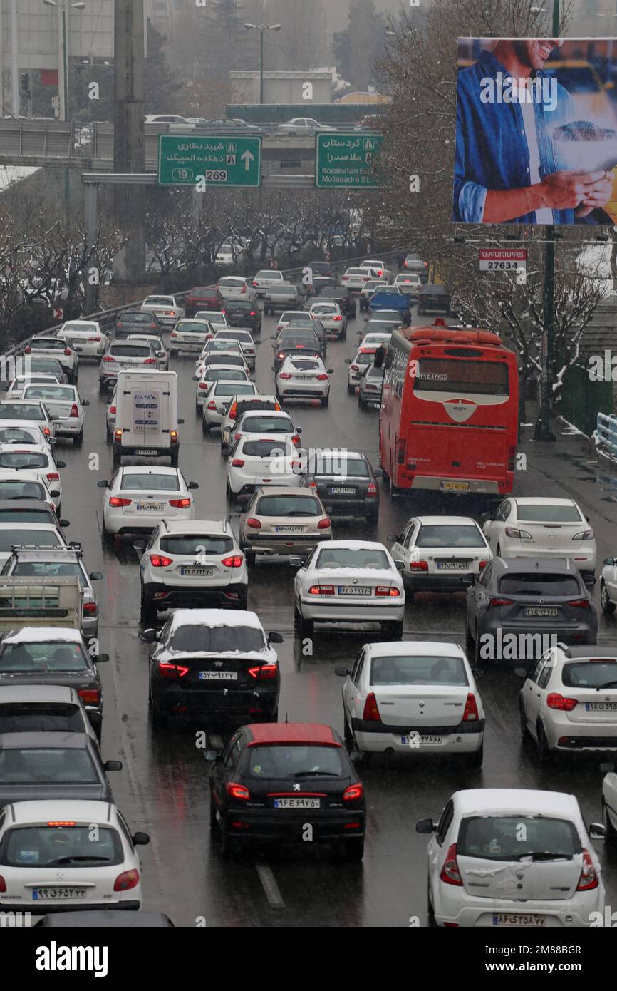 Tehran, Tehran, Iran. 11th Jan, 2023. Vehicles drive slowly along an ...