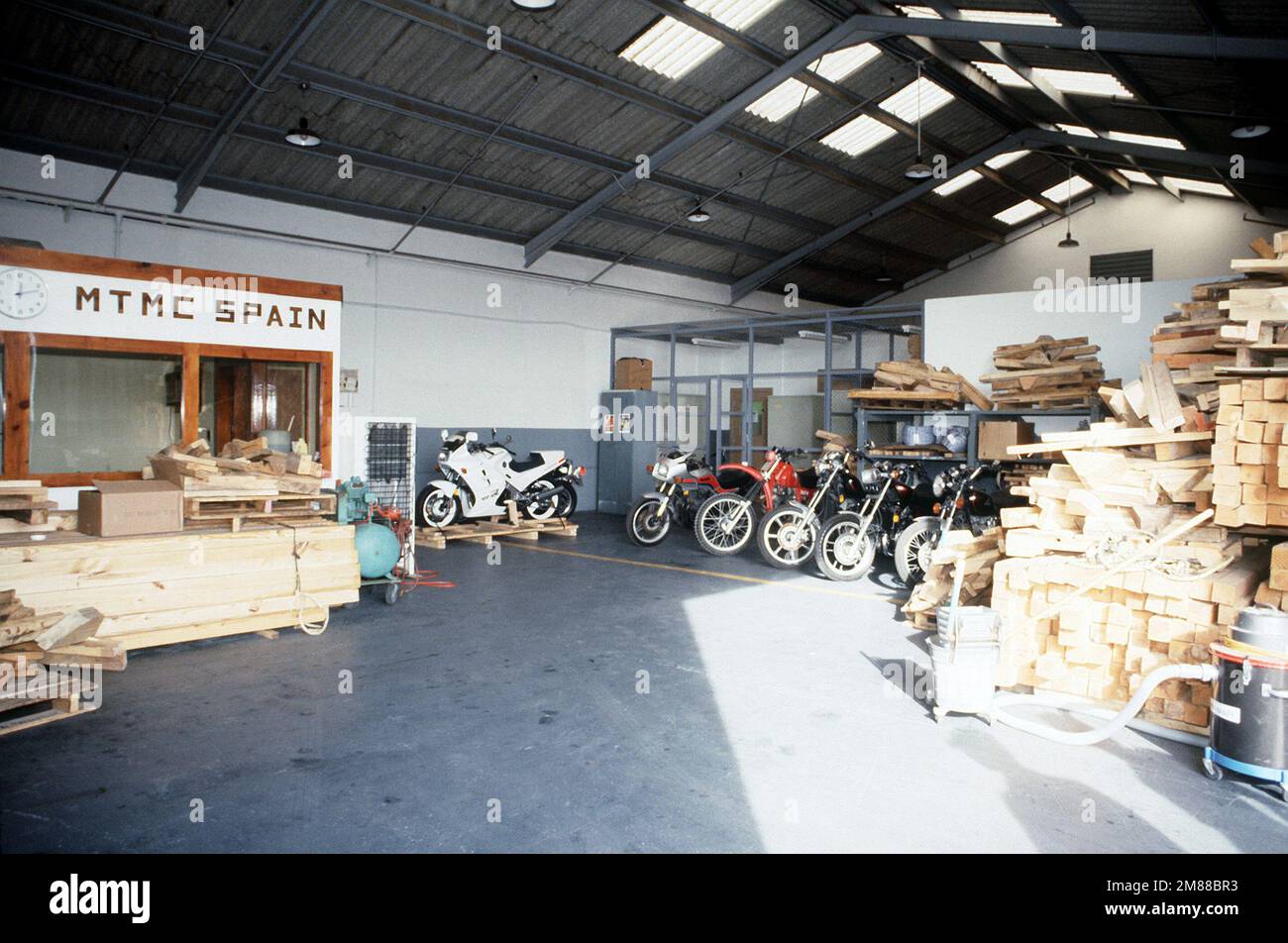 Motorcycles stand inside the privately owned vehicle (POV) warehouse of ...