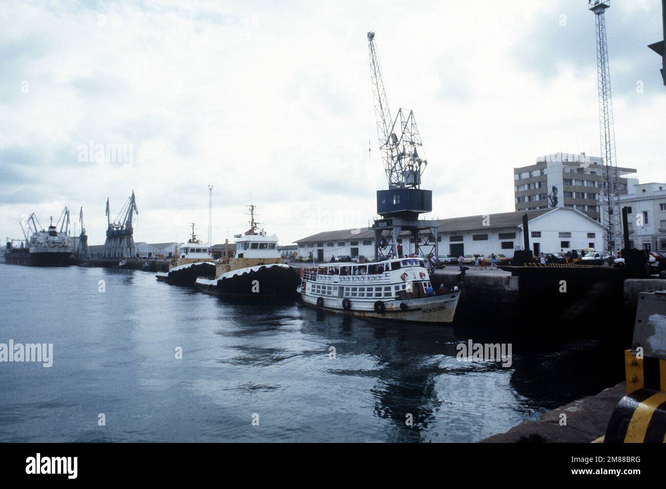 A passenger ferry waits at a pier at the Military Traffic Management ...