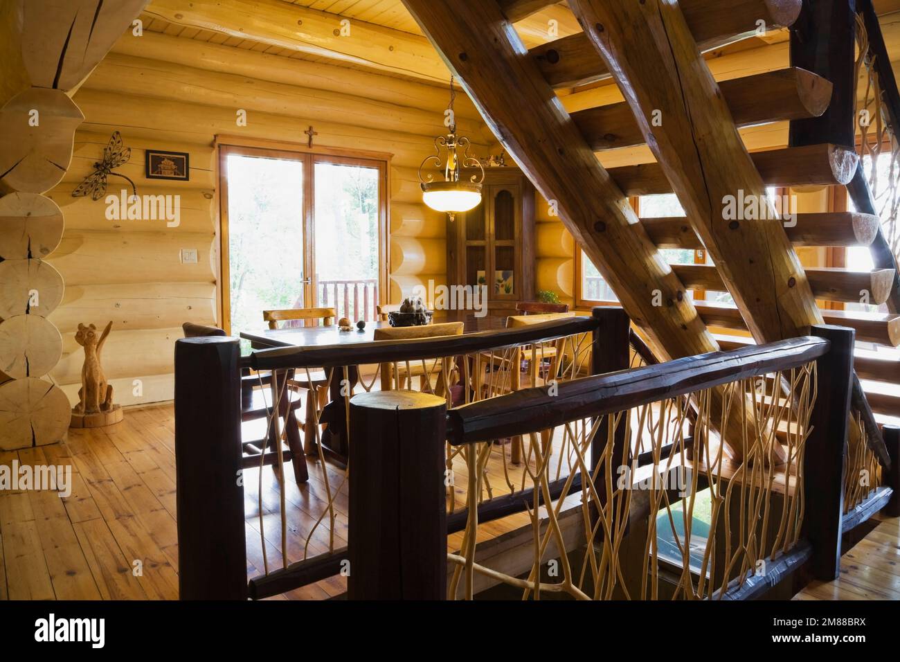 Cedar wood dining table with high back chairs in dining room and ...