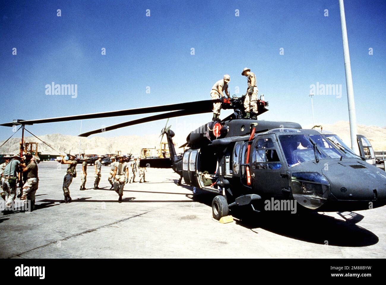 A UH-60 Black Hawk helicopter unloaded from the cargo ship LYRA for ...